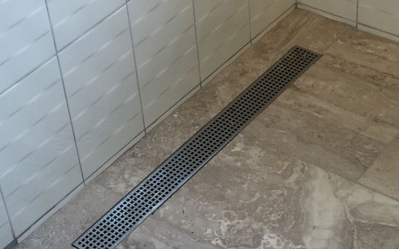 Tile Redi shower base with trench drain by Just Right Remodeling in ...
