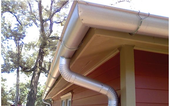 Half round gutters with round downspout made out of galvalume by Lang ...
