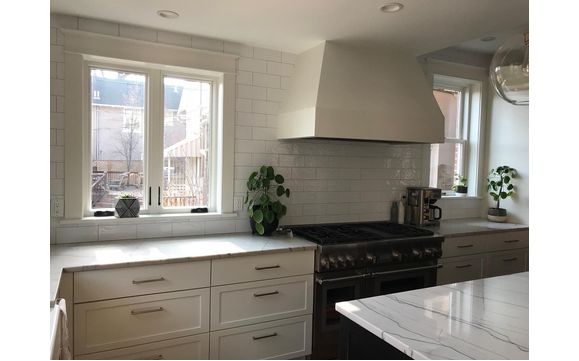 Kitchen backsplash- subway tile in offset pattern up to the ceiling by ...
