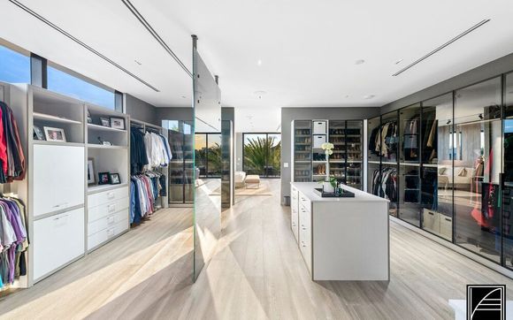His & Hers Walk-in Closet by VelArt by VelArt Kitchen, Bath & Closets ...